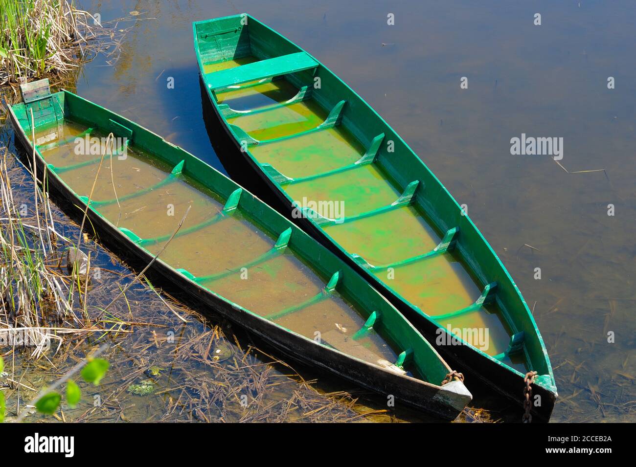 Photo landscape of two old green boat on the river bank. Boats ...