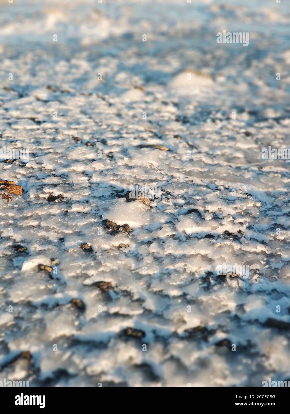 Road covered with ice in the headlights Stock Photo - Alamy