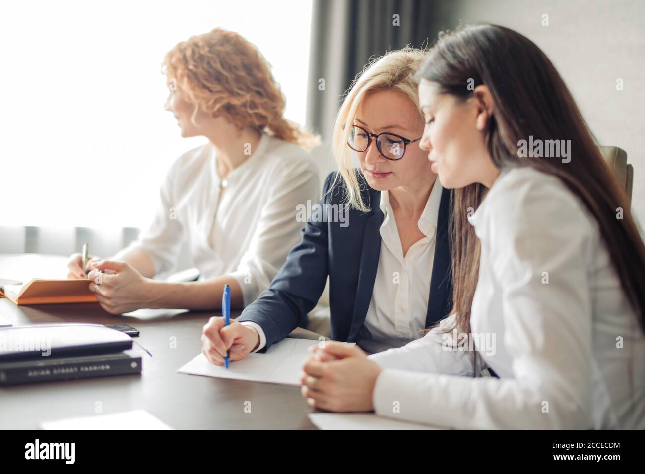 Three caucasian female students or interns in white shirts , intern ...