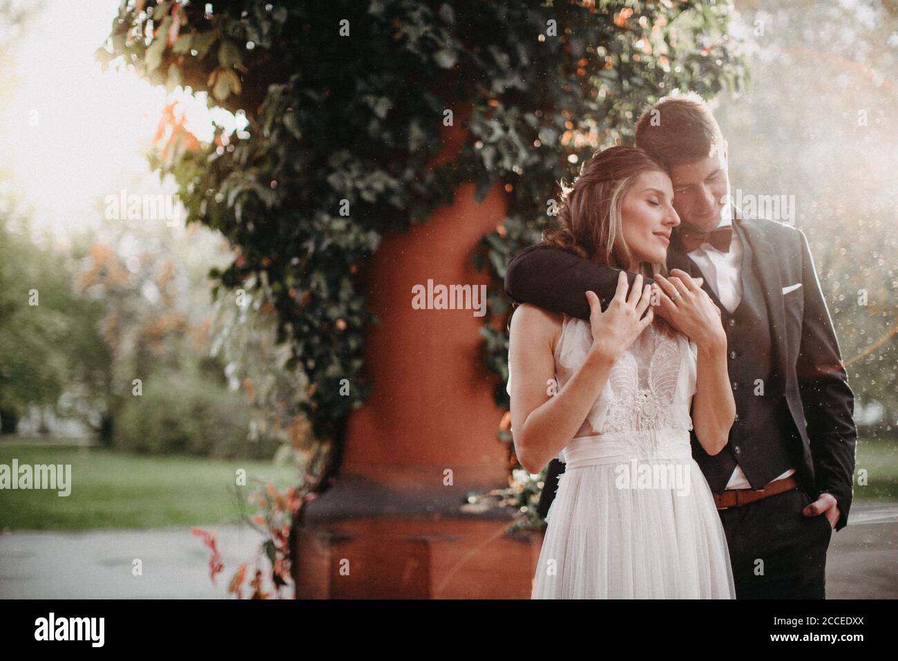 happy bride and groom outside Stock Photo - Alamy