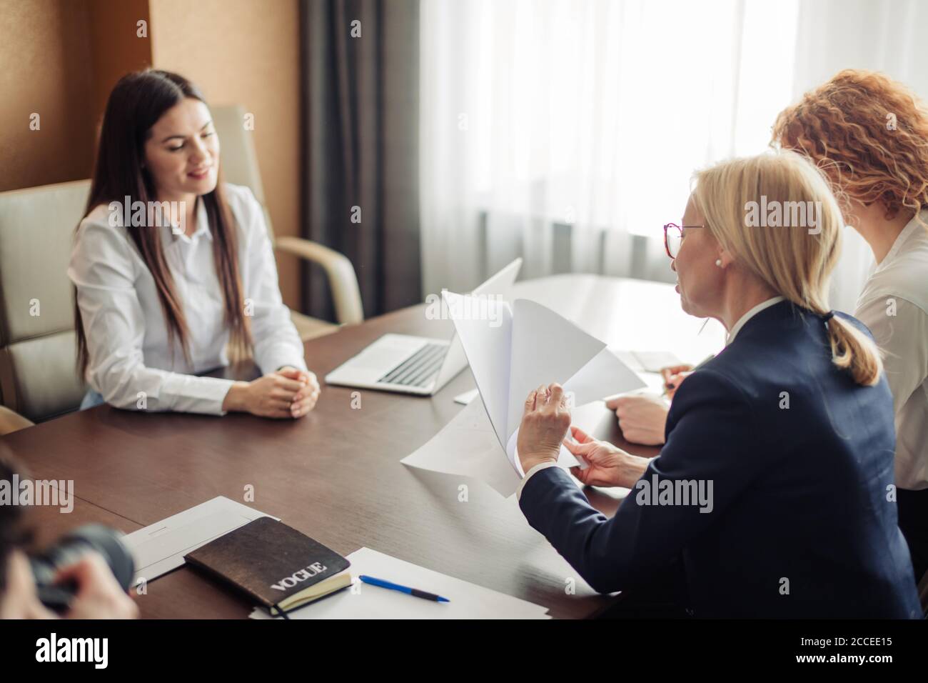 Woman job applicant having an interview with two female corporate ...