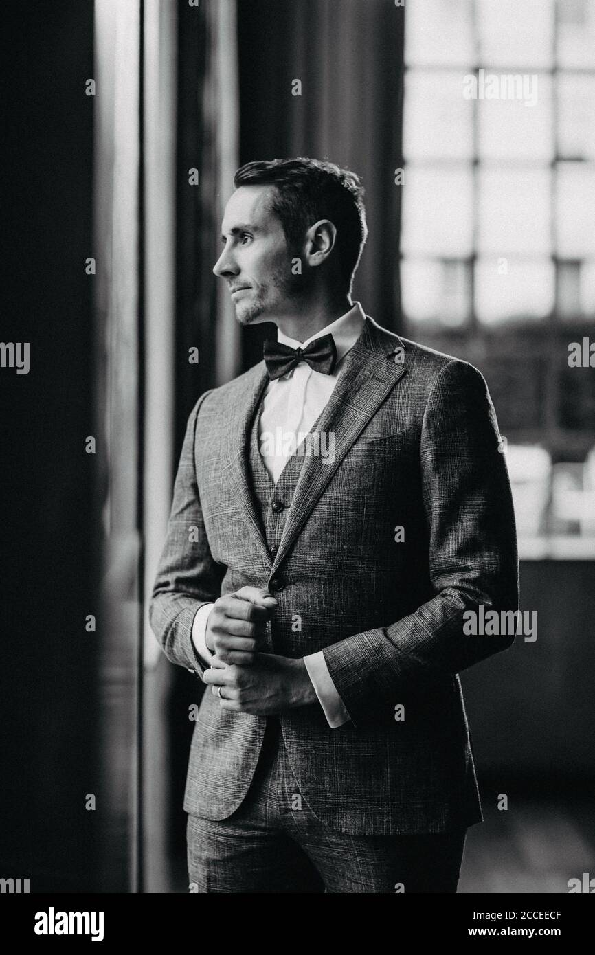 Man, suit, bow tie Stock Photo - Alamy
