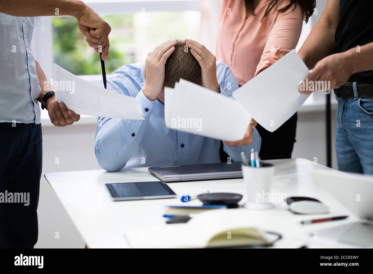 Stress At Workplace In Office. Business Headache Stock Photo - Alamy