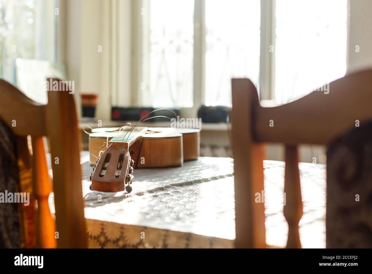 broken guitar with torn strings Stock Photo - Alamy