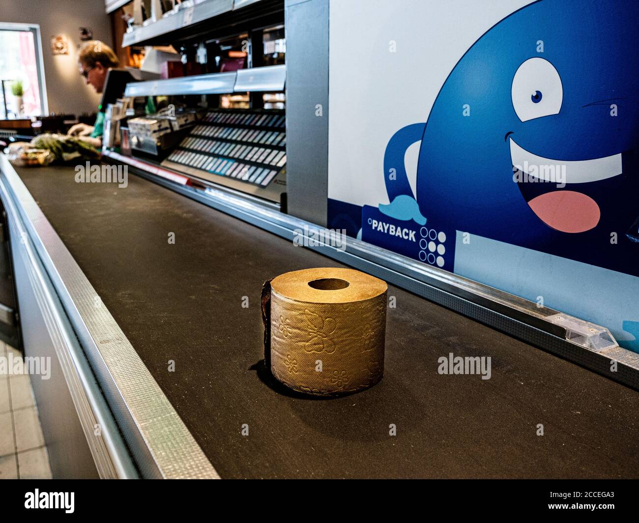 Golden toilet paper roll on cash register tape hi-res stock photography ...