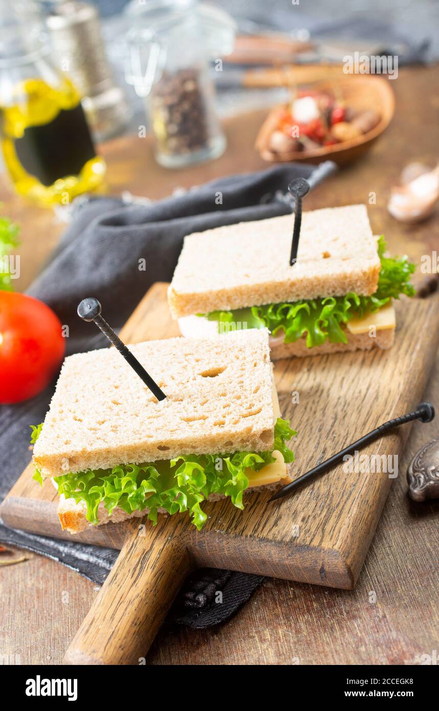 club sandwich- toasted sandwich with ham, tomato, lettuce and cucumber ...