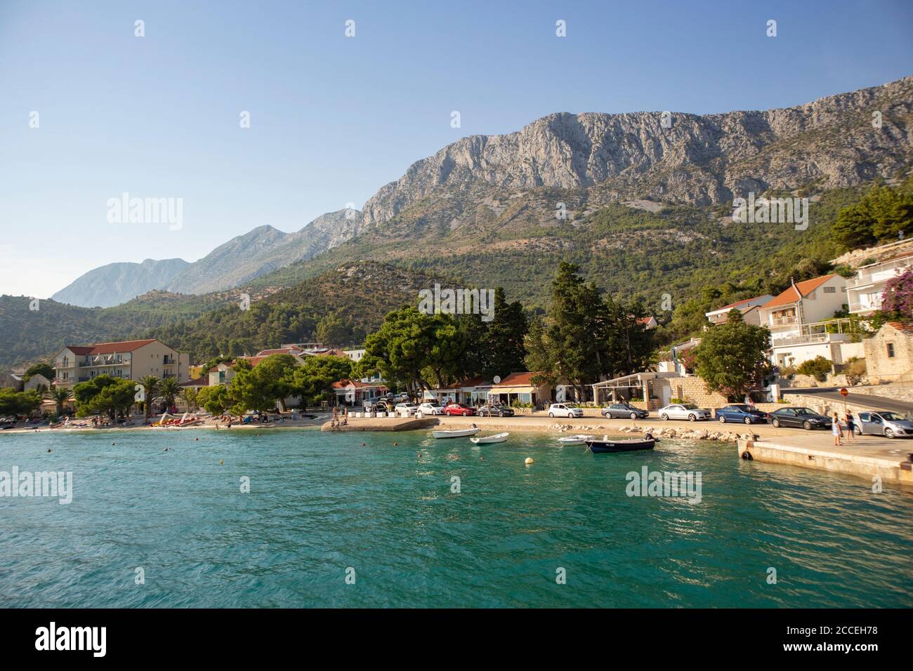 Drvenik/Croatia-August 3rd,2020: Biokovo mountain towering above town ...
