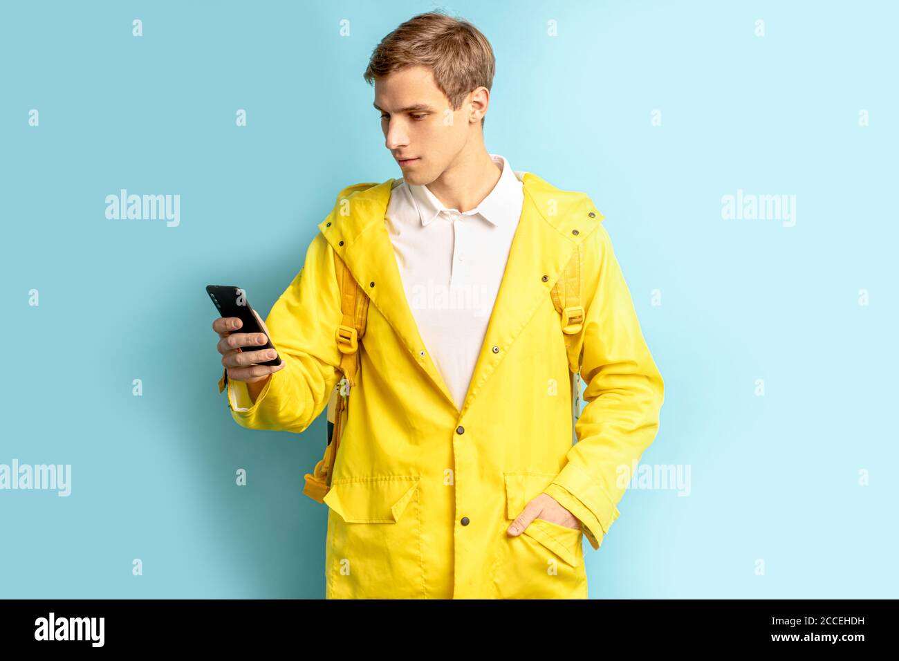 fast, express delivery by young caucasian man isolated over blue ...