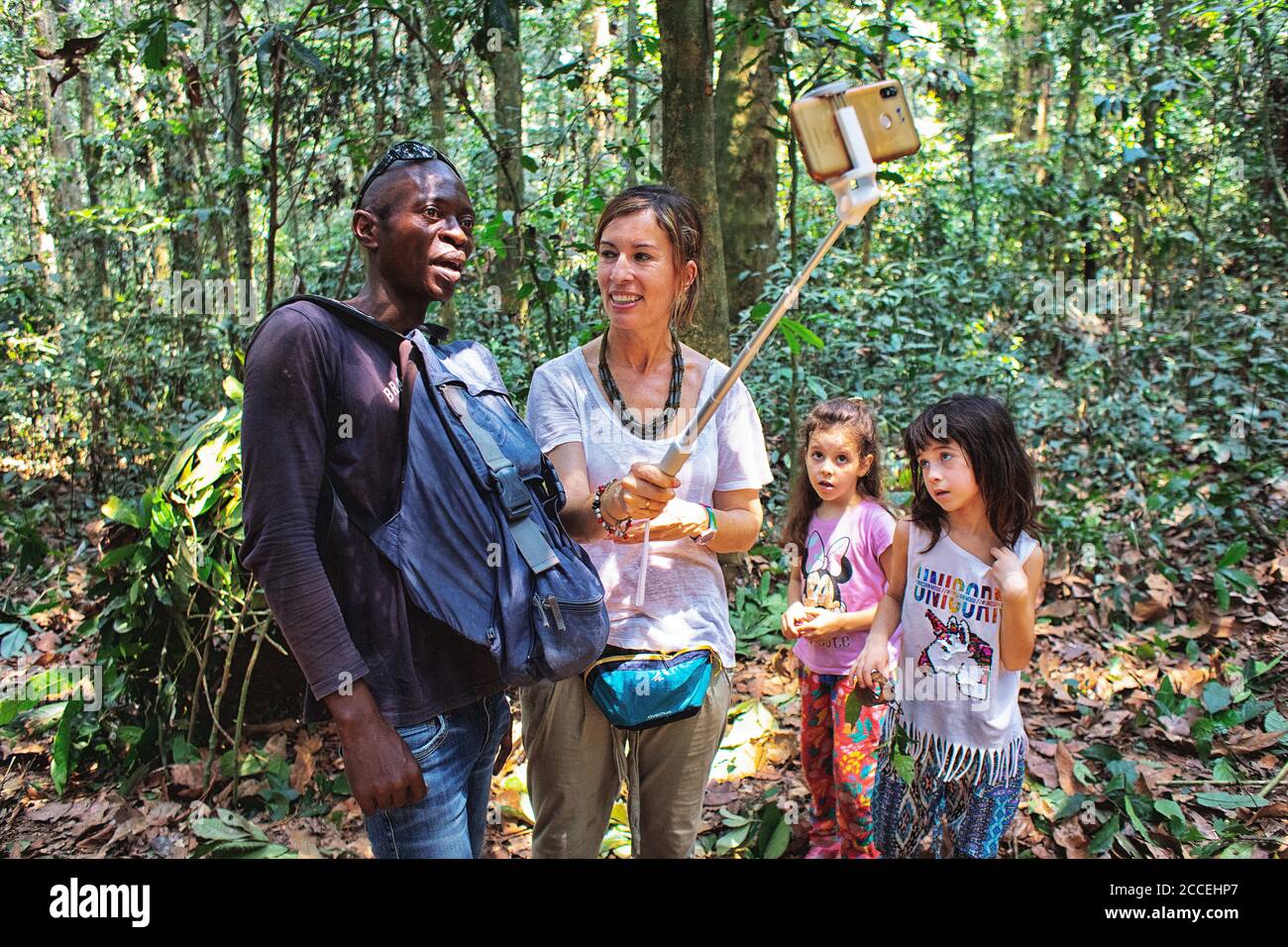 Tourist and pygmy tribe in the dzanga sangha forest reserve hi-res ...