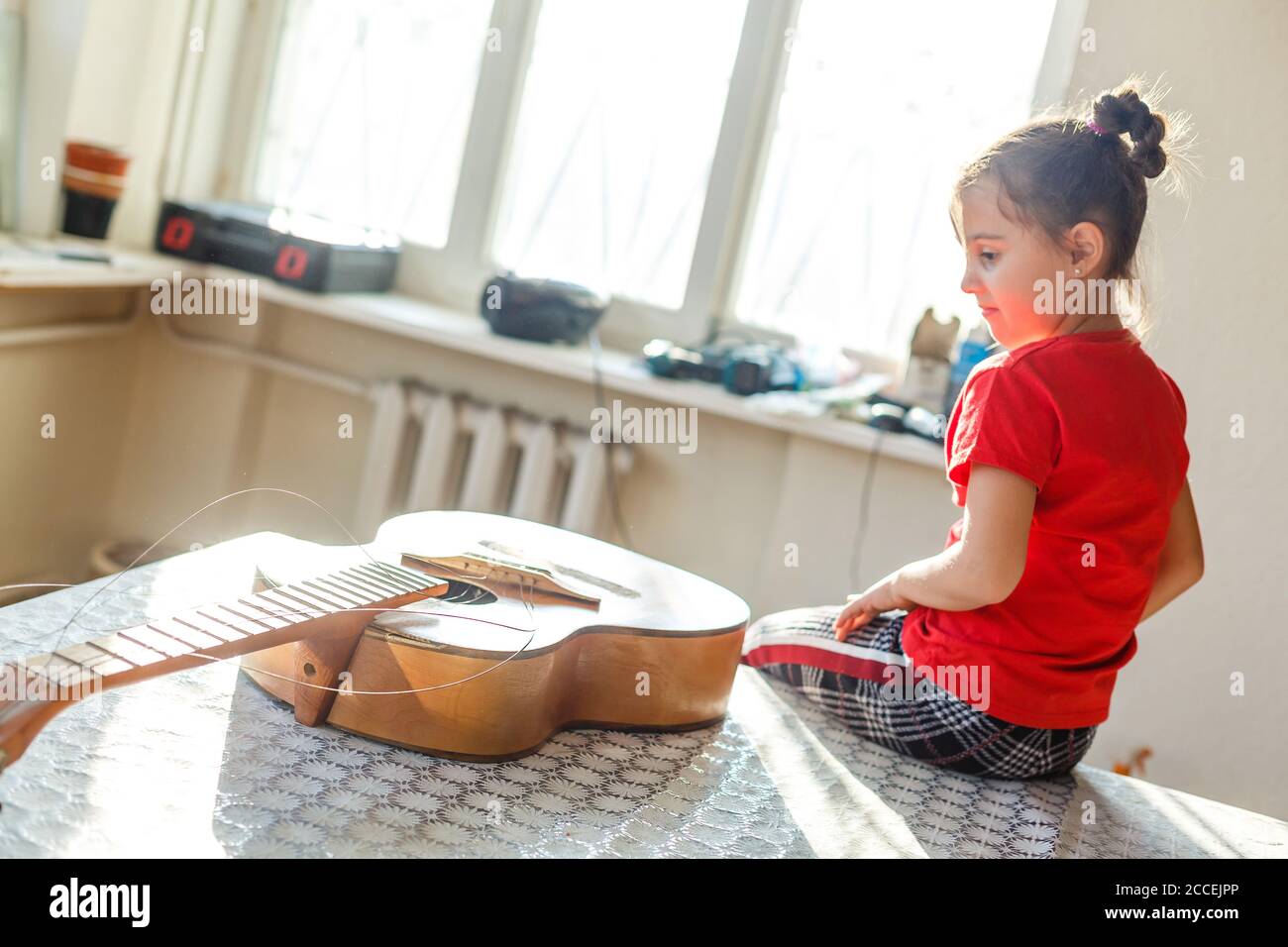 Closeup strings of a broken guitar. Broken music instrument Stock Photo ...