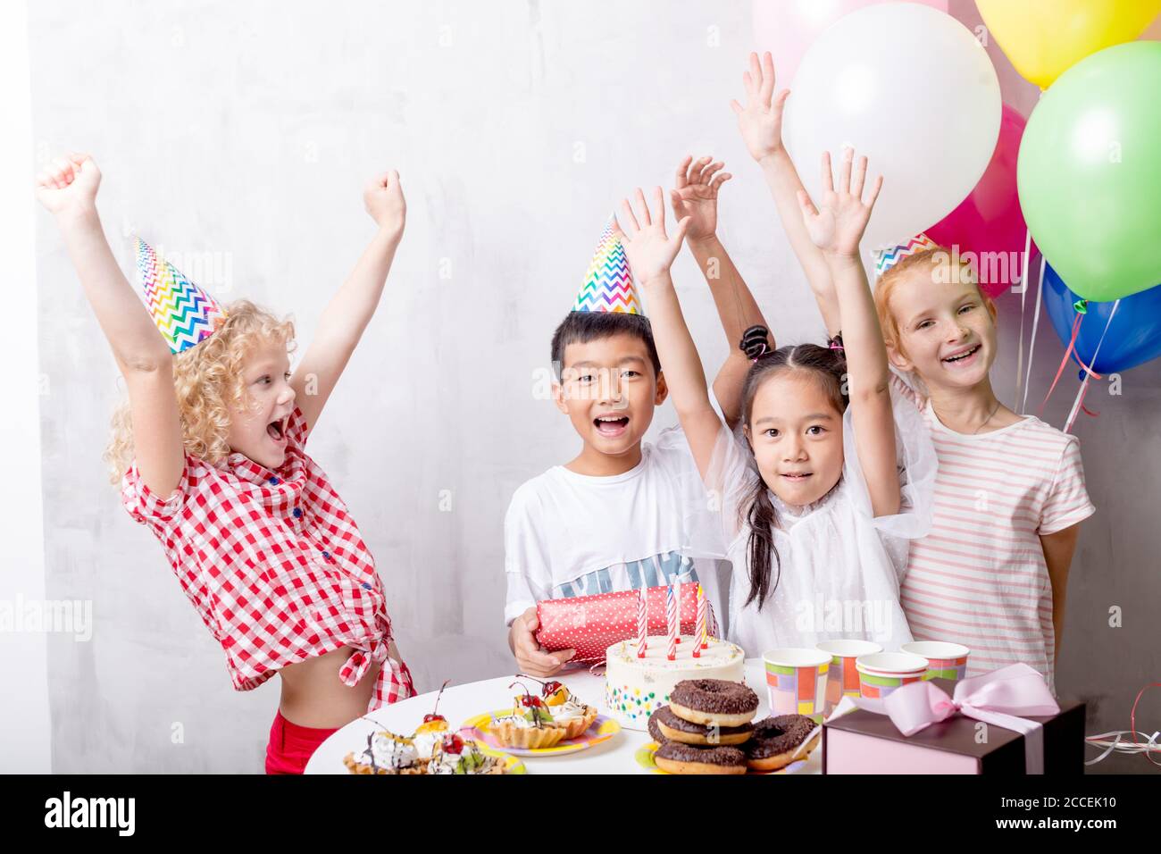Group of kids celebrate birthday party together Stock Photo - Alamy