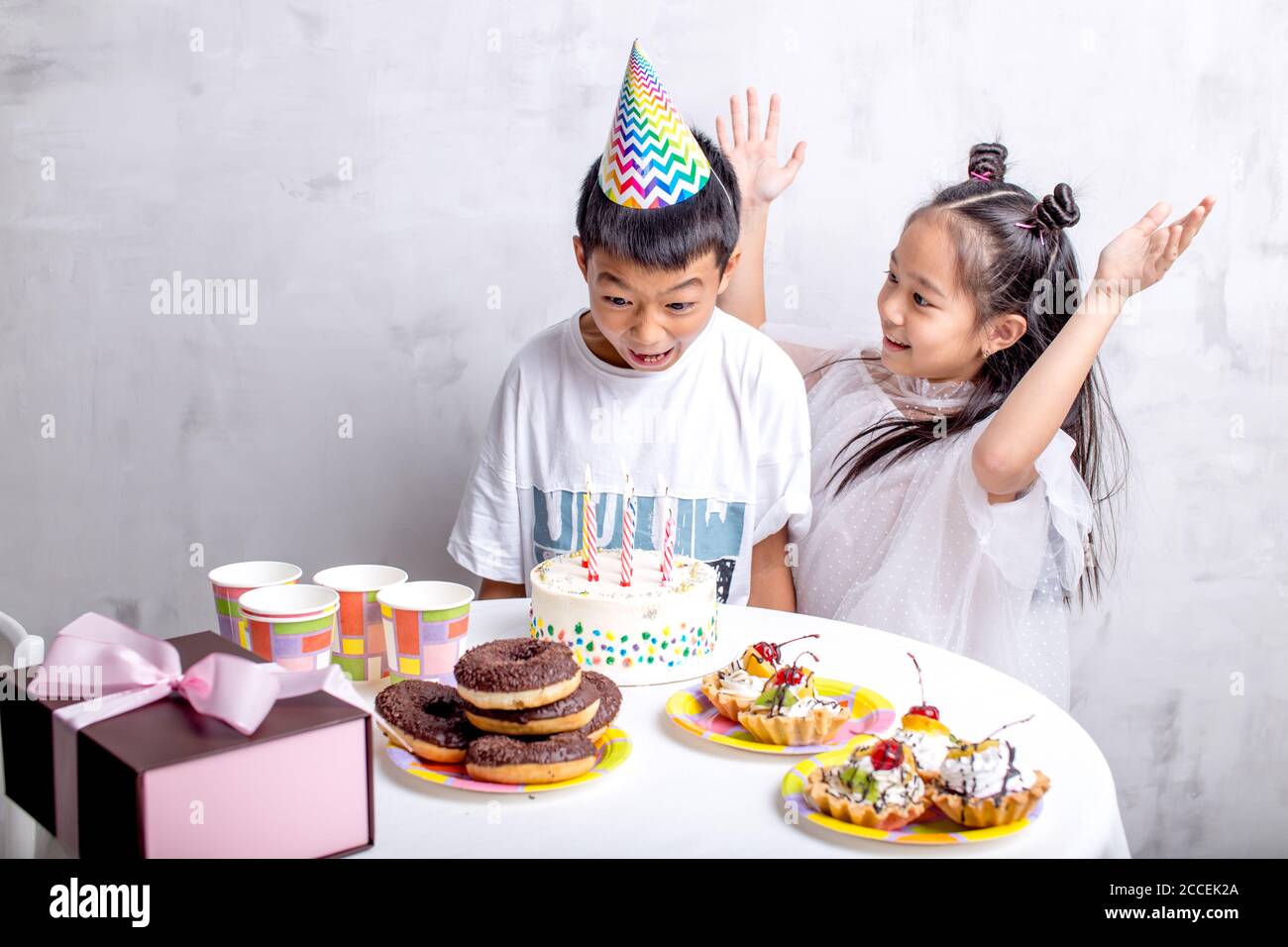 angry surpised boy isn't happy to have the little cake. frustration ...