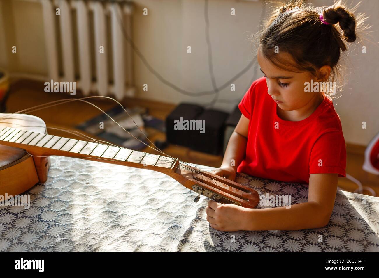 Closeup strings of a broken guitar. Broken music instrument Stock Photo ...