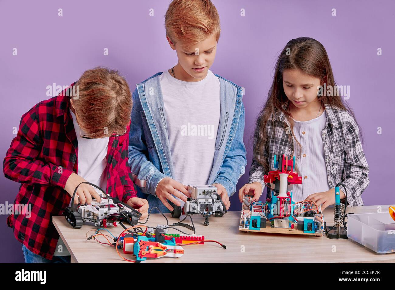 portrait of creative enthusiastic children spending time in engineering ...