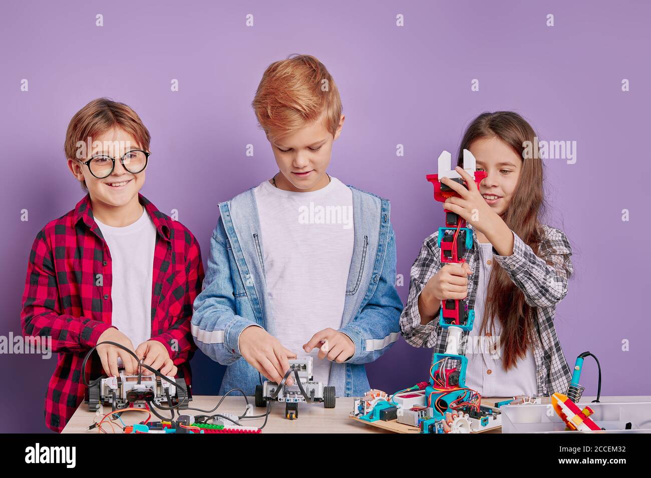portrait of creative enthusiastic children spending time in engineering ...