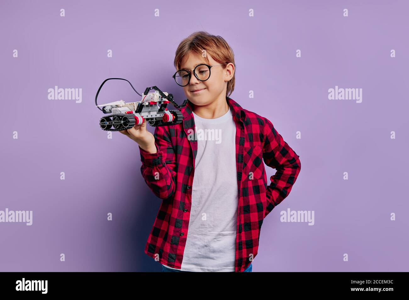 caucasian little boy kid keen on robotics, portrait of boy with robot ...