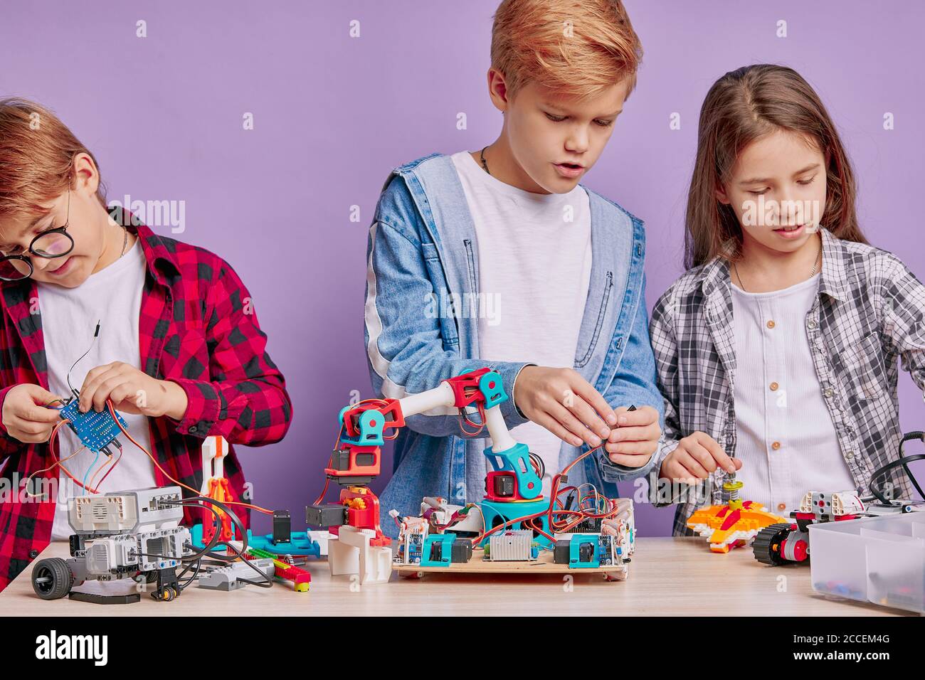 portrait of brainy children interested in engineering, robotics, future ...