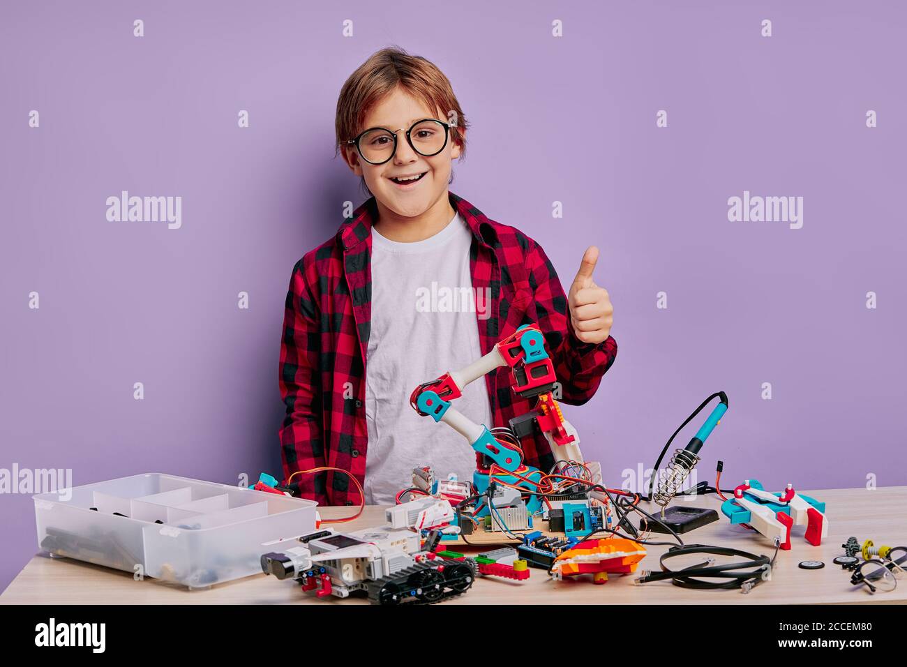 Young caucasian boy spending free time after school in the engineering ...
