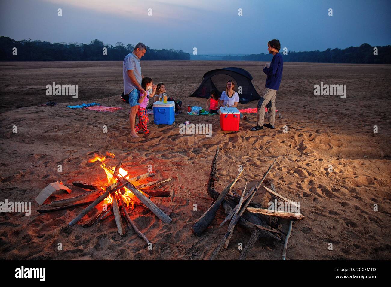 Tourists dining on a sandy island in the Dzanga River. Dzanga sangha ...