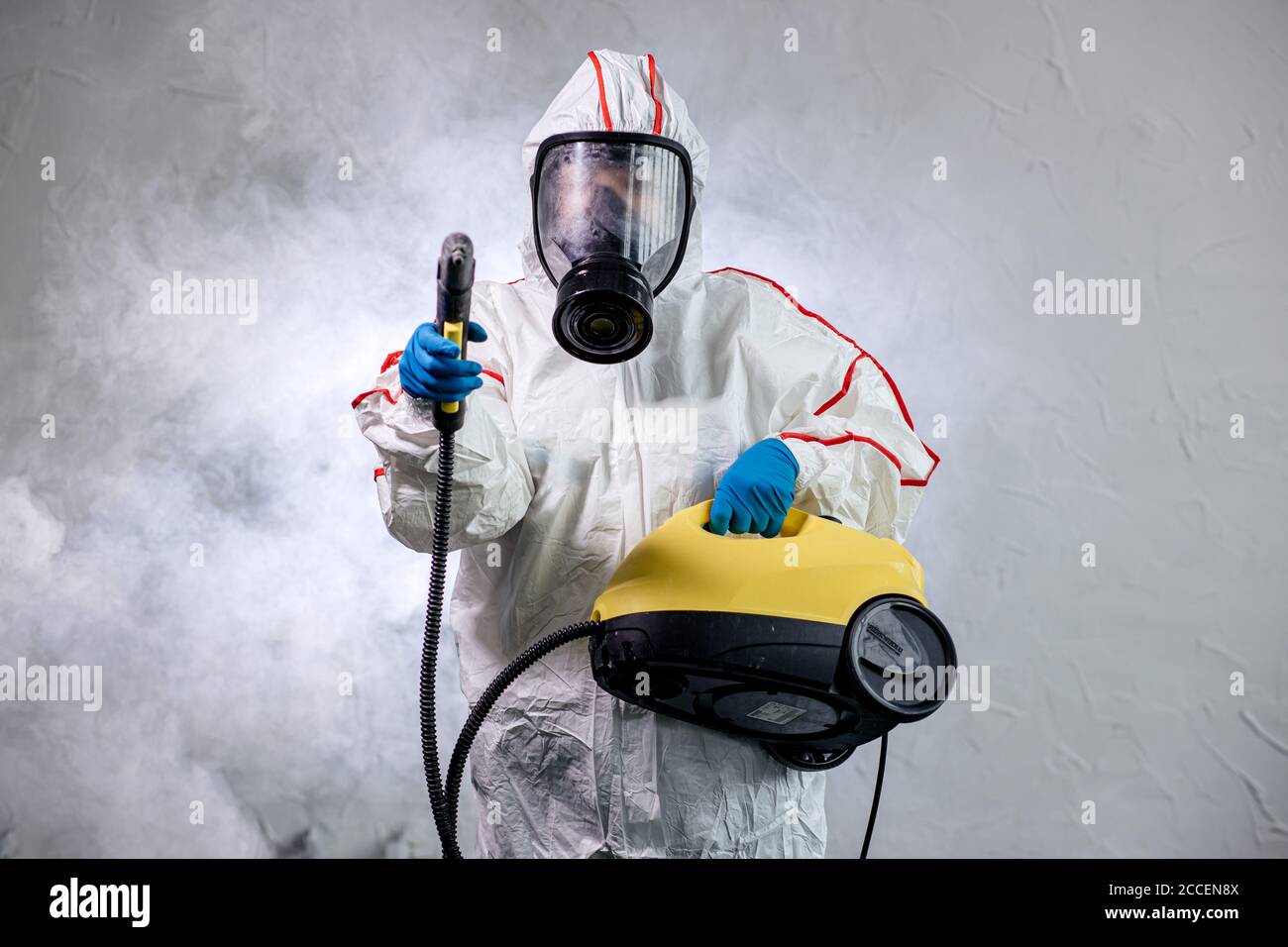 caucasian disinfector use sprayers and germs that adhere on objects on ...