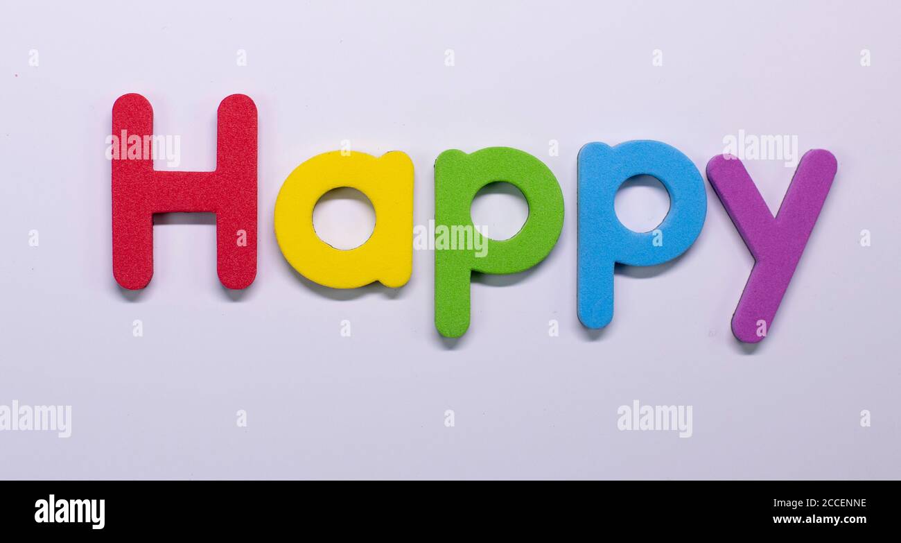 Word Happy written with color sponge Stock Photo - Alamy