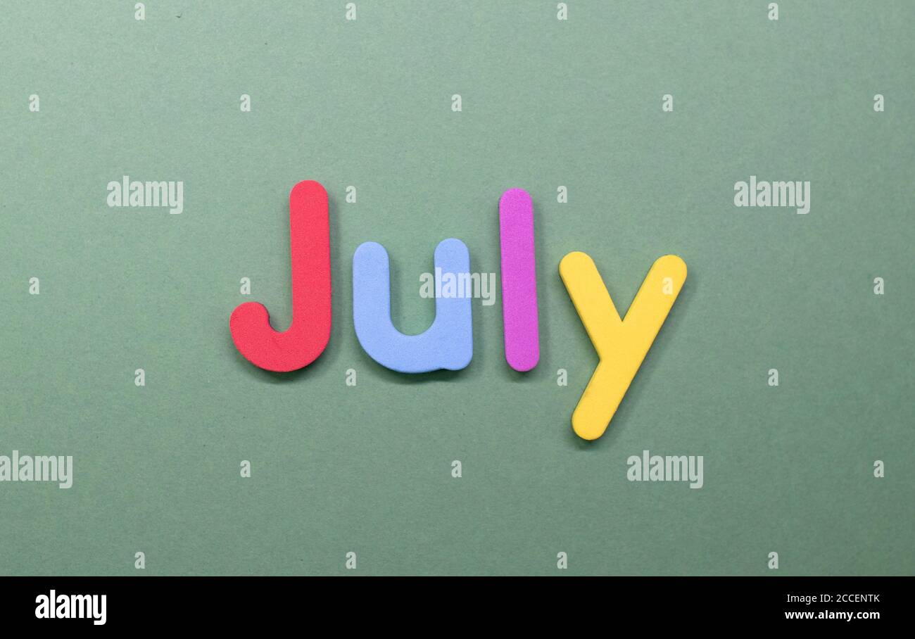 Word July written with color sponge Stock Photo - Alamy