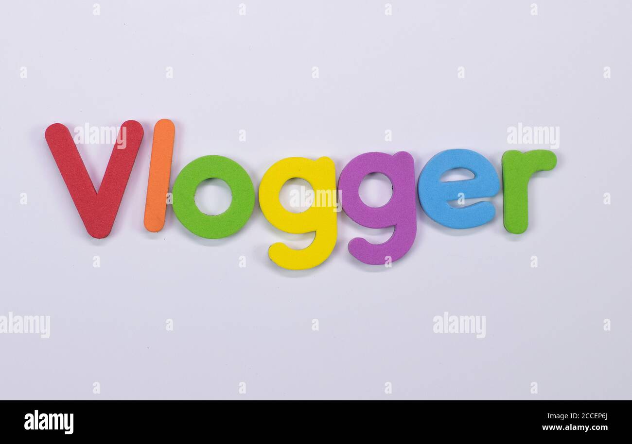 Word Vlogger written with color sponge Stock Photo - Alamy