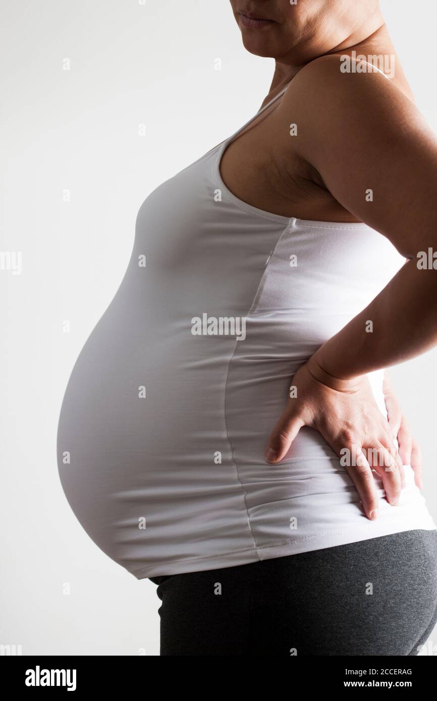 Pregnant woman with lower back pain Stock Photo - Alamy