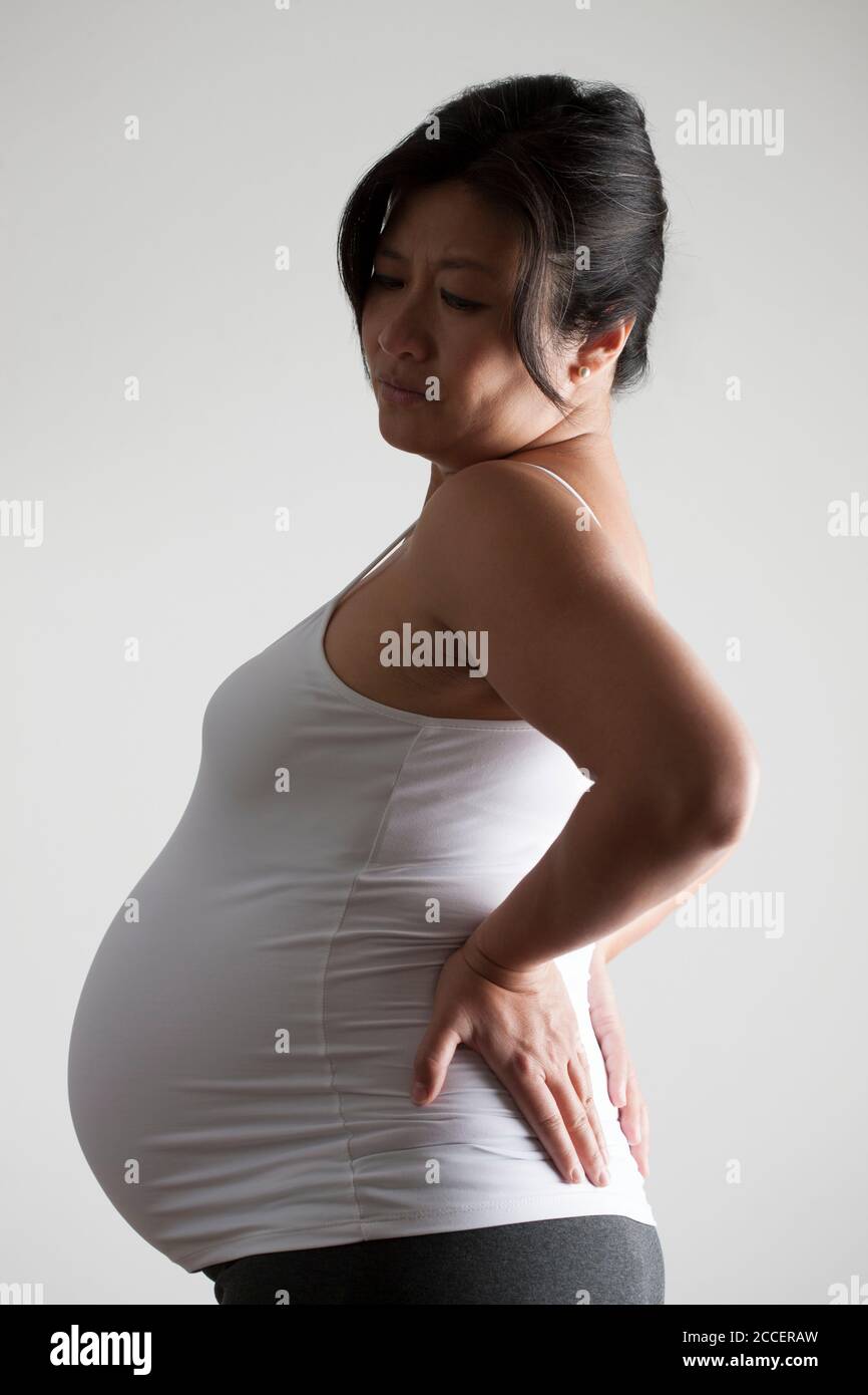 Lower back pain pregnant woman hi-res stock photography and images - Alamy