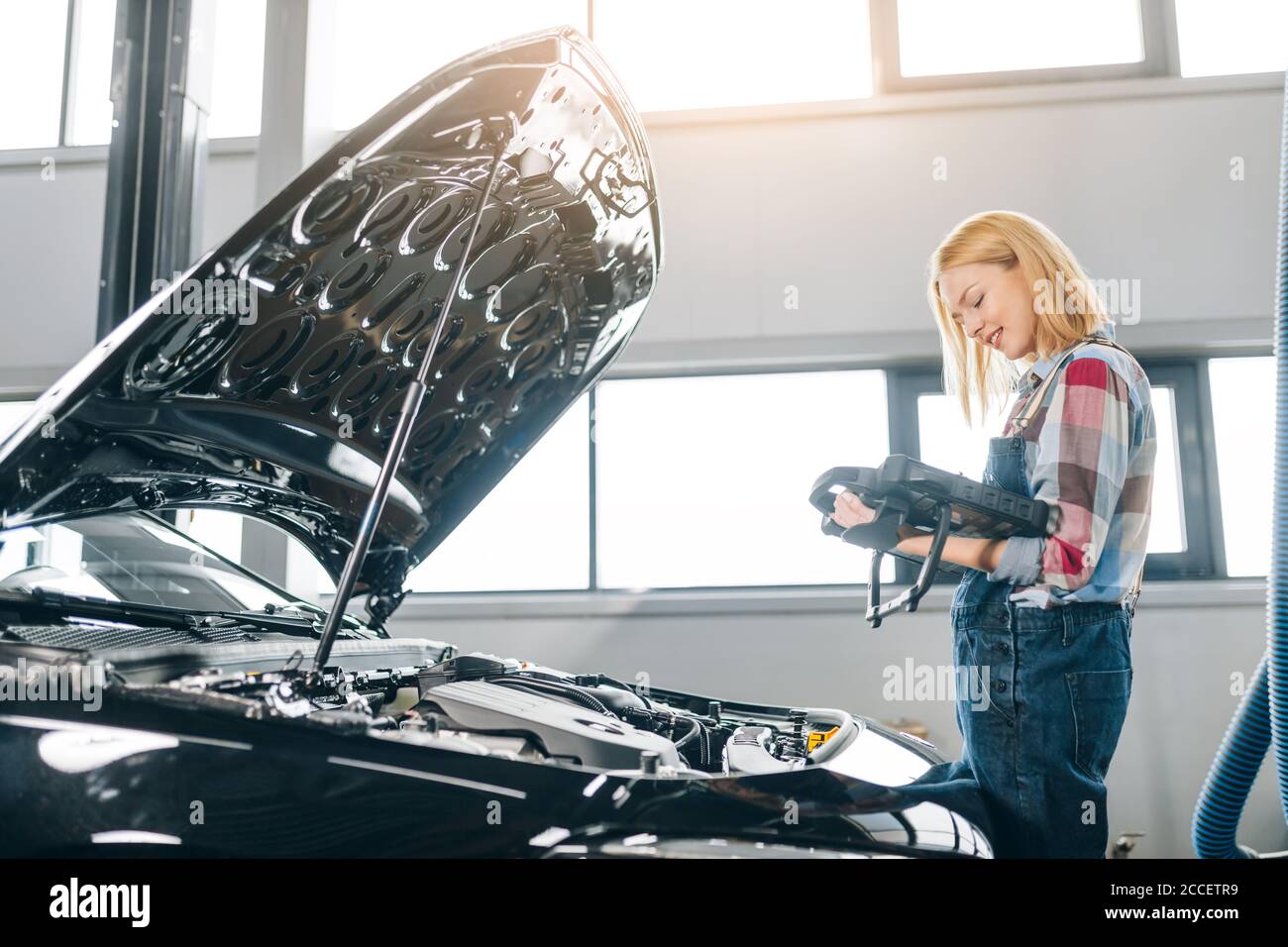 beautiful staff offering a qualified scanning of your vehicle. close up ...