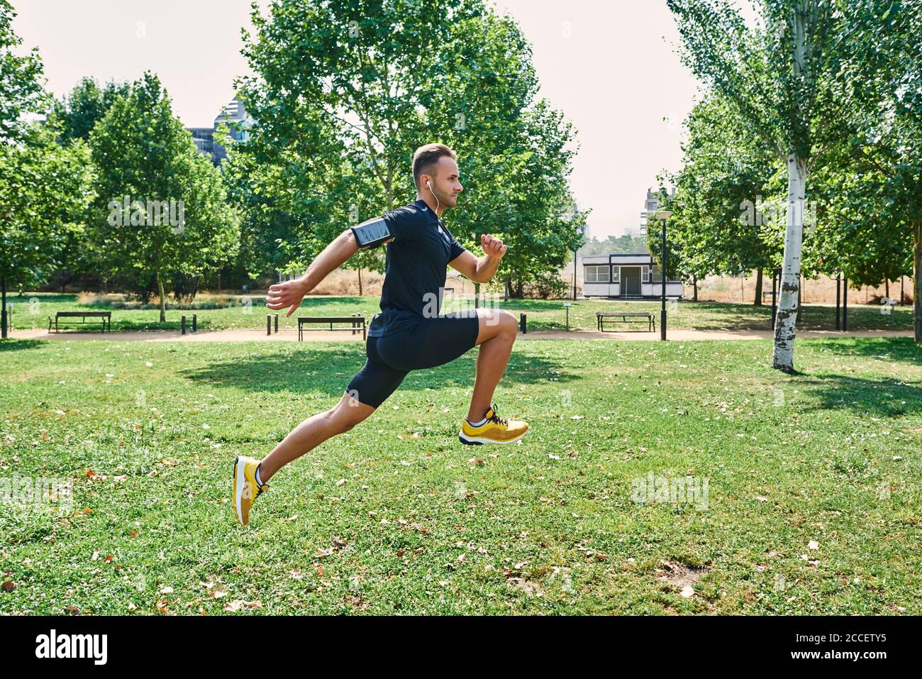 Man running in a park Stock Photo - Alamy