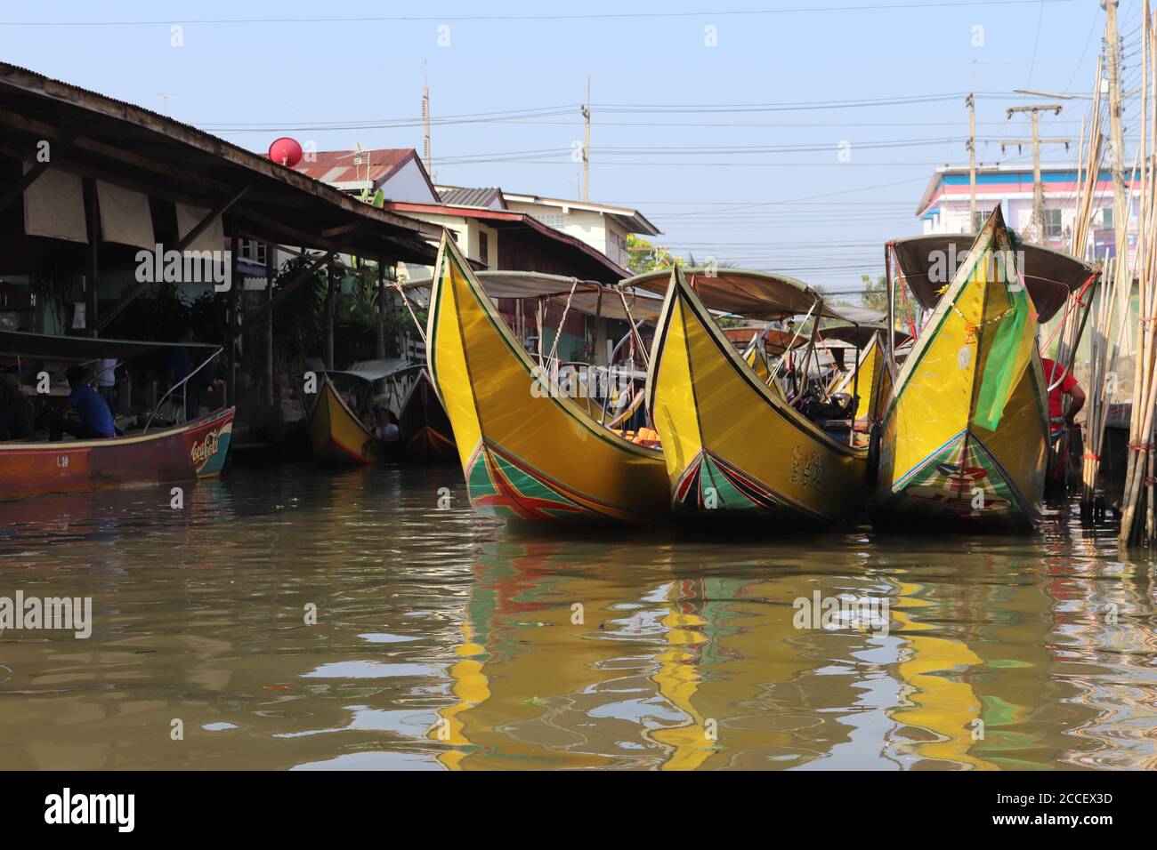 A trio of boats waiting for there customers at the floating market ...