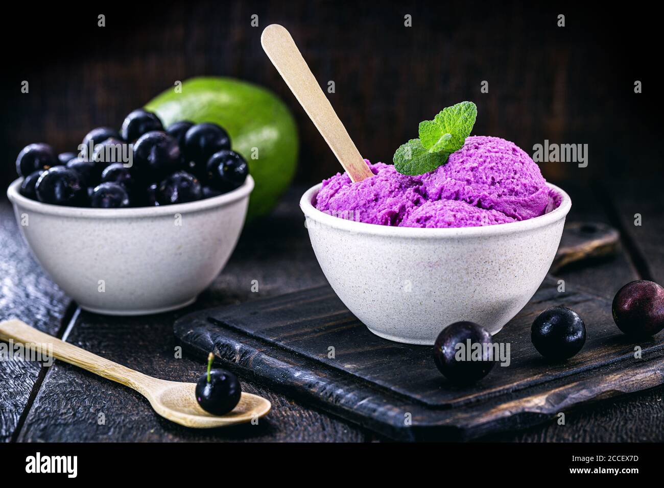 exotic jabuticaba ice cream, purple color. Dessert served in ...