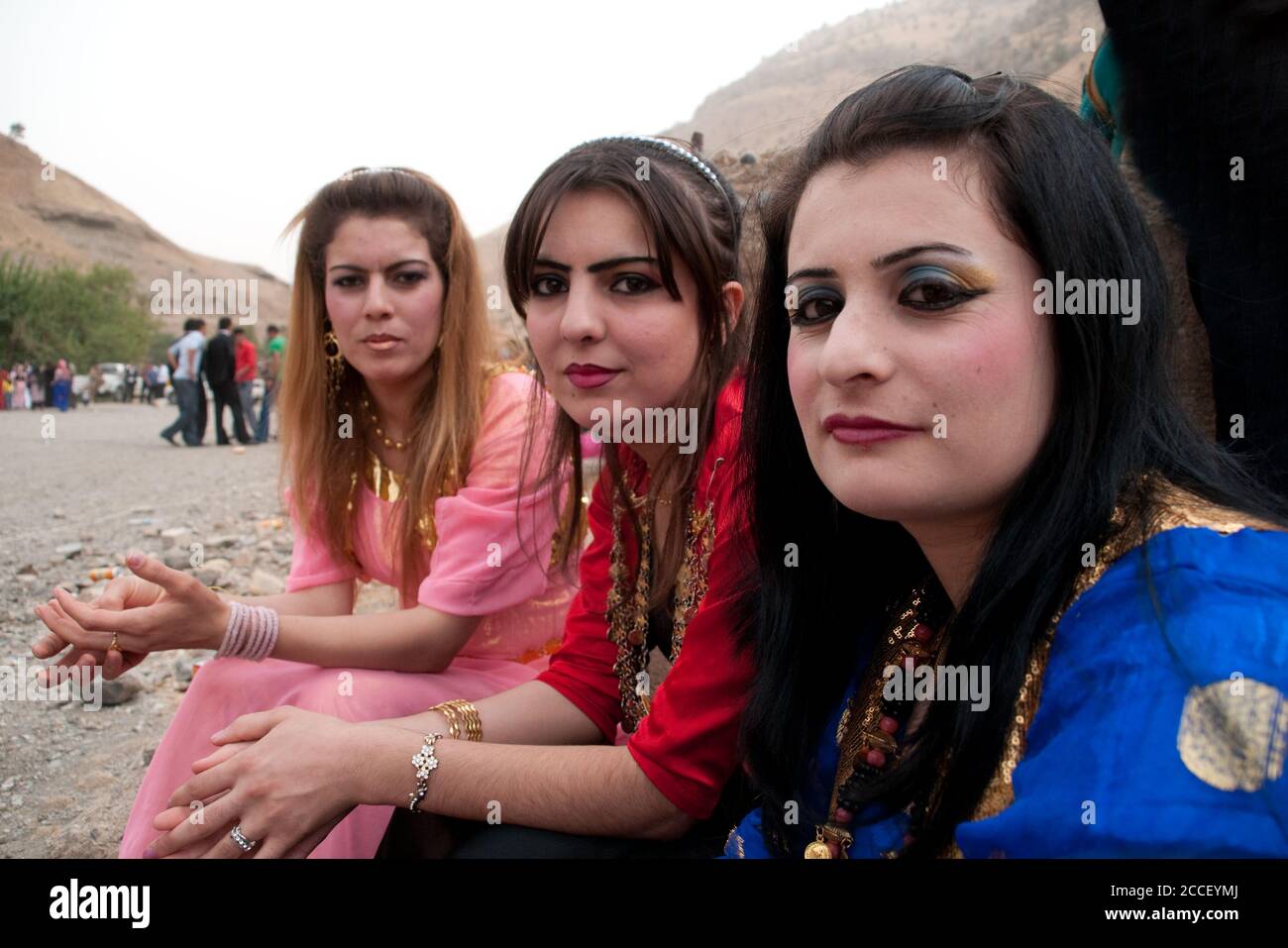 Three young single Kurdish woman in traditional clothes at a wedding in Rowanduz,in the ...