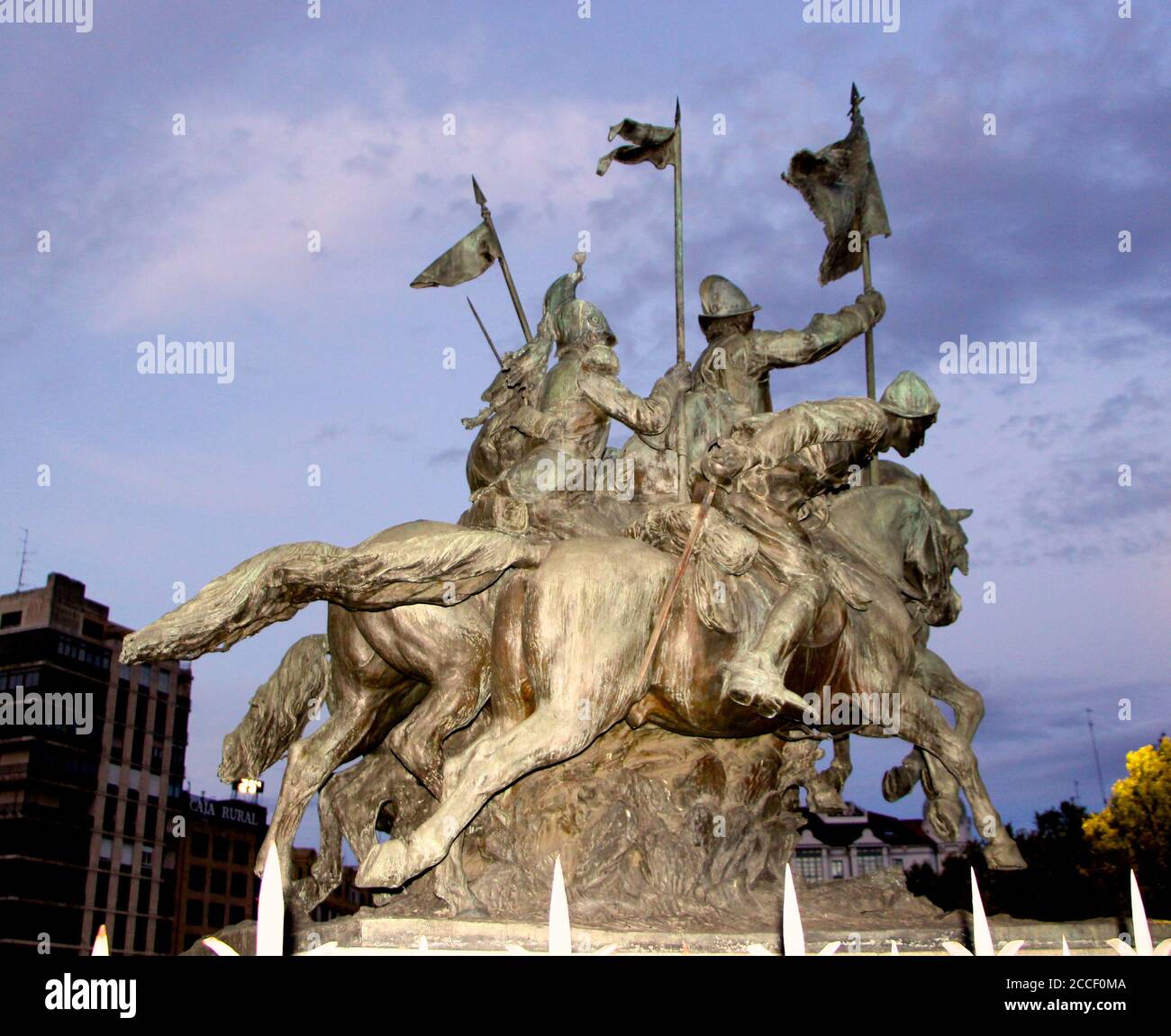 Statue of three cavalry soldiers on running horses carrying banners in ...