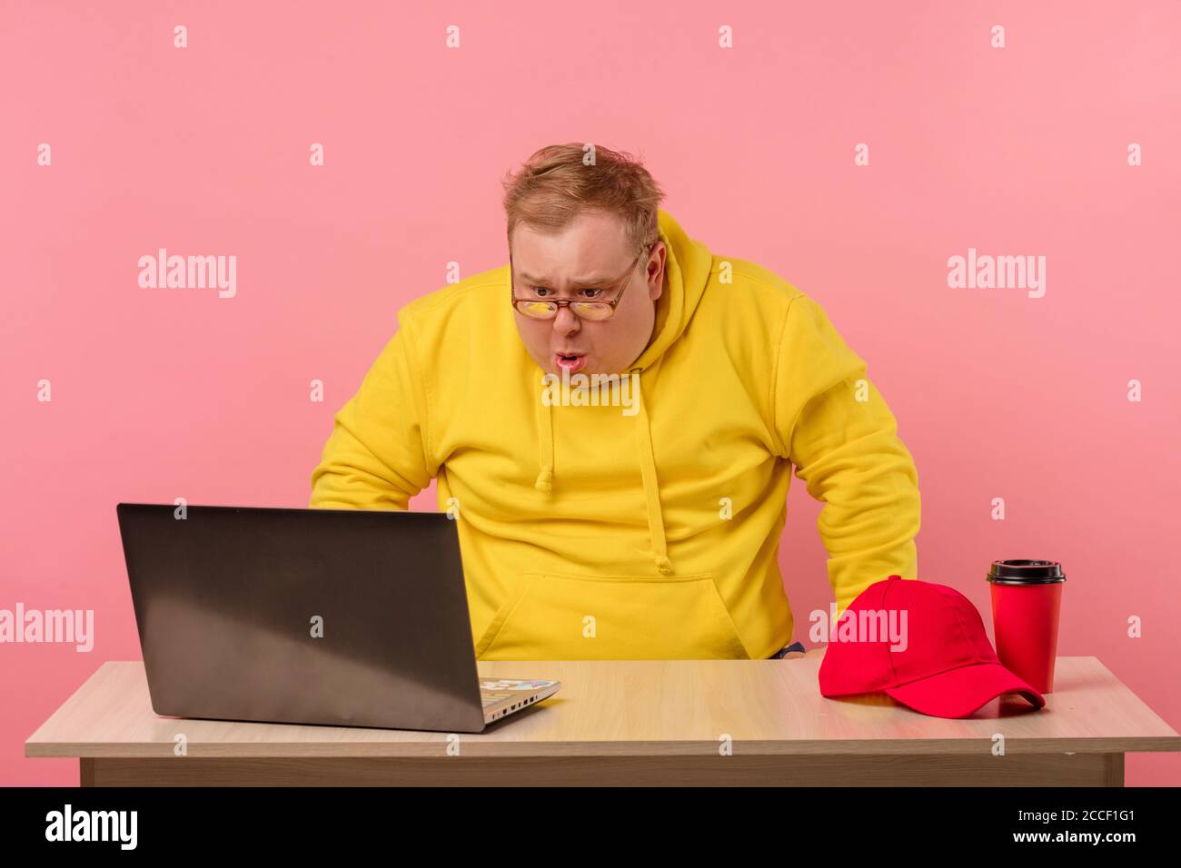 Indoor shot of surprised shocked man with corpulent body opens mouth ...
