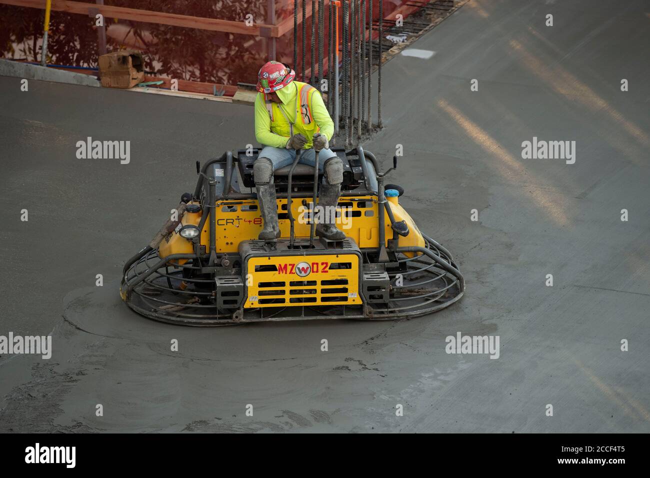 Austin, Texas, USA. 25th July, 2020. Concrete crews work on the parking ...