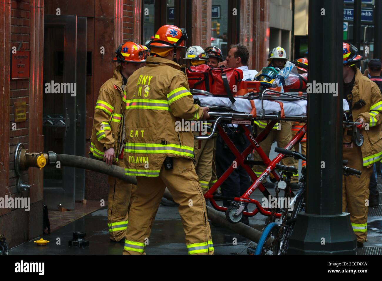 Fire company works to put out fire in NYC building Stock Photo - Alamy