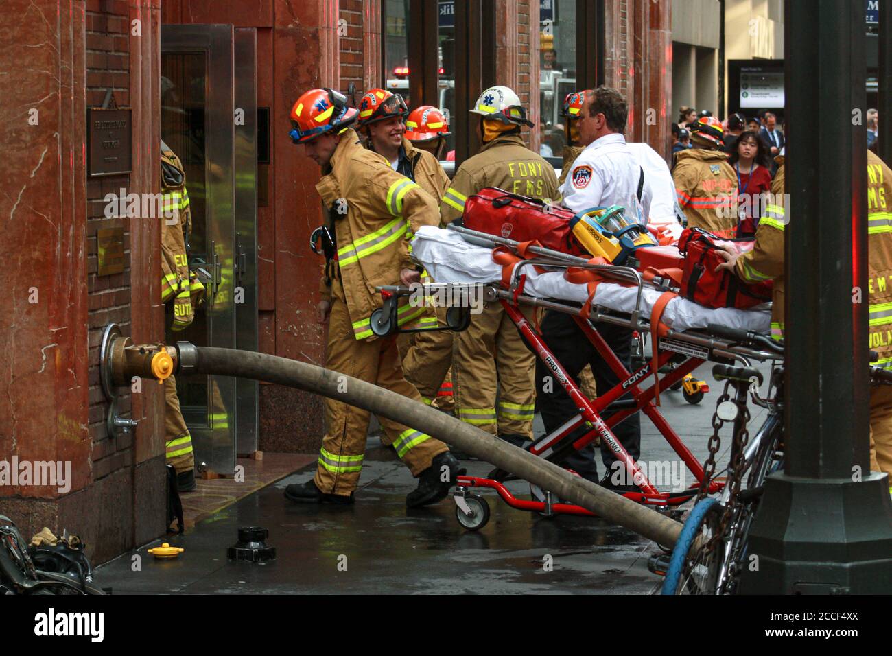 Fire company works to put out fire in NYC building Stock Photo - Alamy