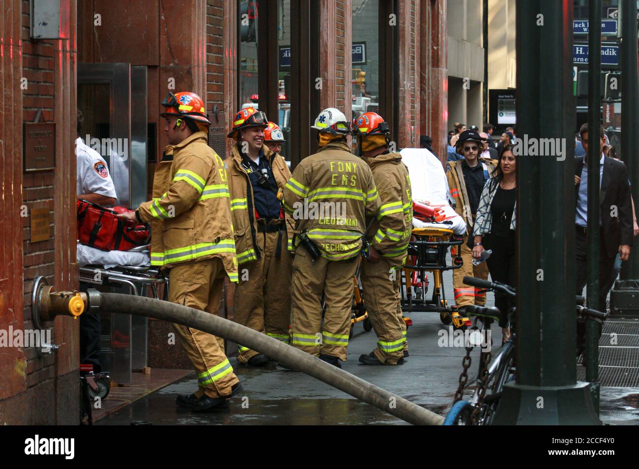 Fire company works to put out fire in NYC building Stock Photo - Alamy