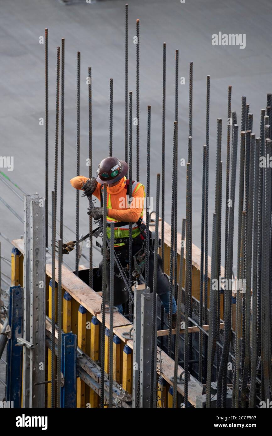 Austin, Texas, USA. 25th July, 2020. Concrete crews work on the parking ...