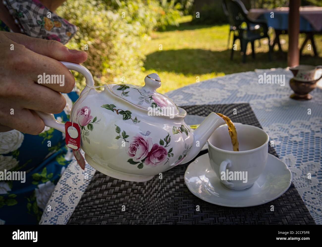 Tea pot pouring tea cup hi-res stock photography and images - Alamy