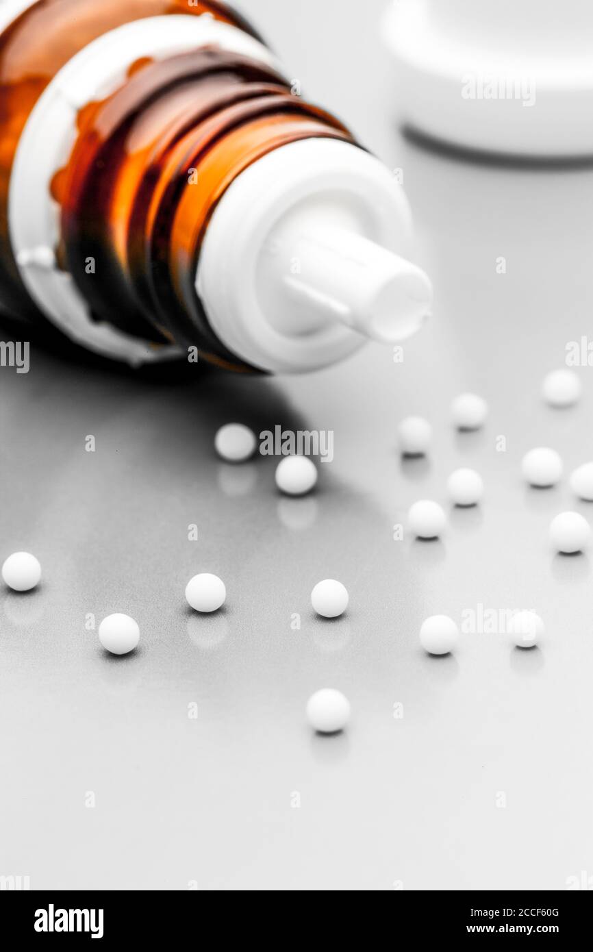 Homeopathic globules with glass vials Stock Photo - Alamy