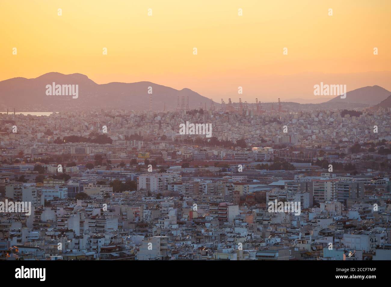 View of Athens from Filopappou hill towards Piraeus at sunset, Greece ...