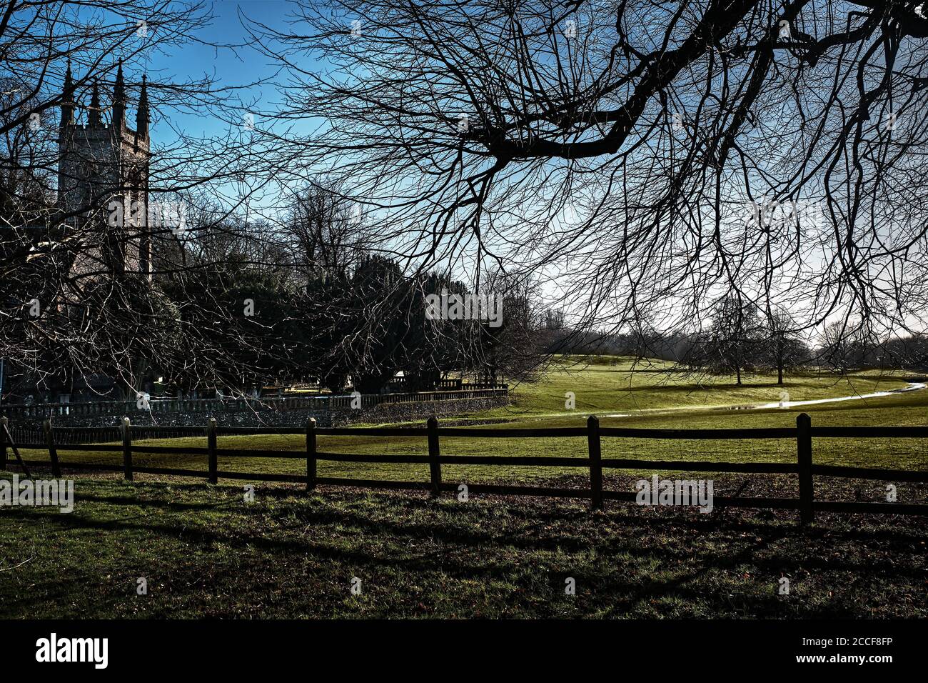 Church Covered By Trees, Fence Infront, Surrounded By Grass Stock Photo ...