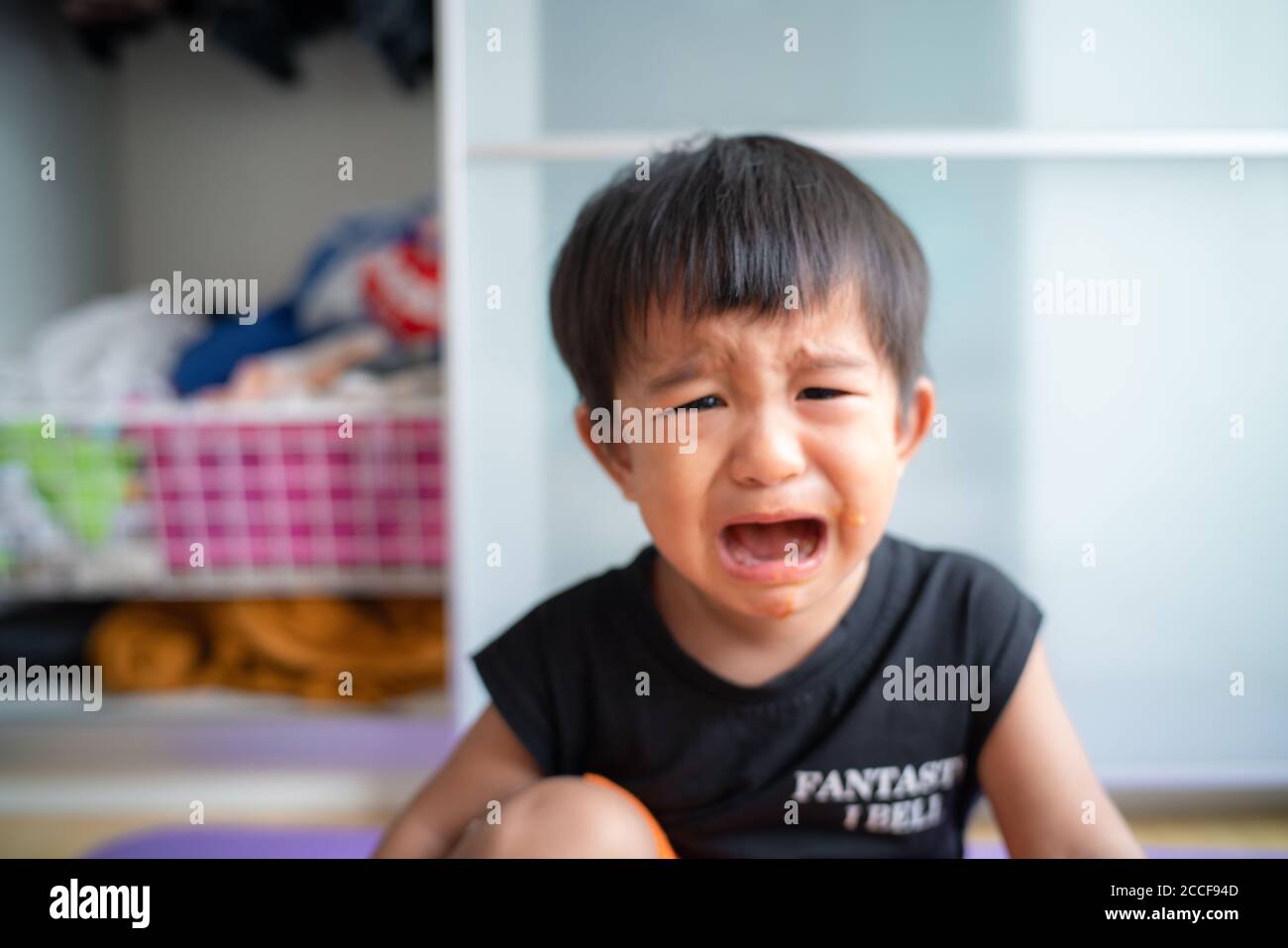 Little asian boy crying bitterly in room of house facial face mood ...