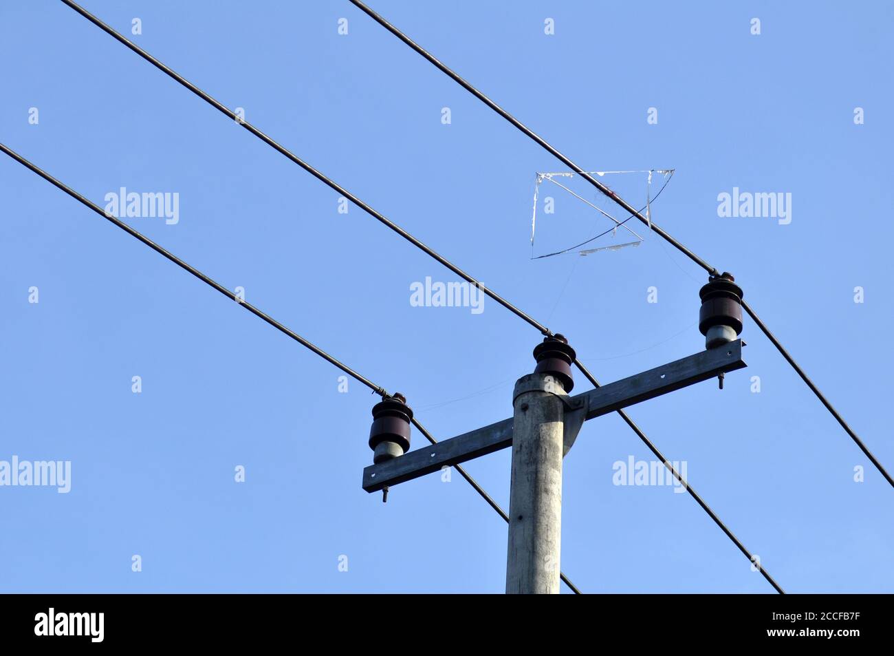 The kite frame is stuck on the electric cable Stock Photo - Alamy