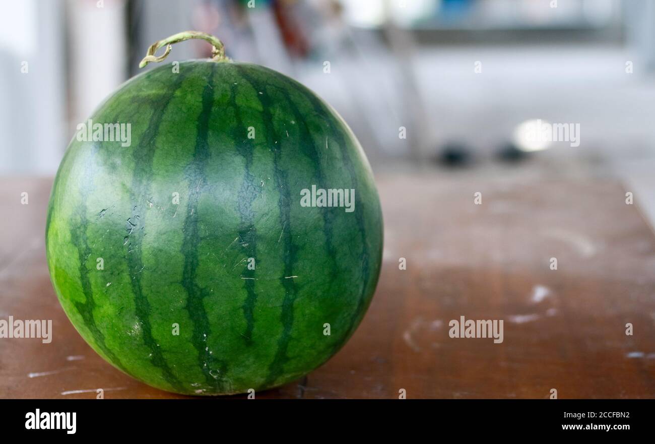 Watermelon on wood background. Originating in West Africa Stock Photo ...