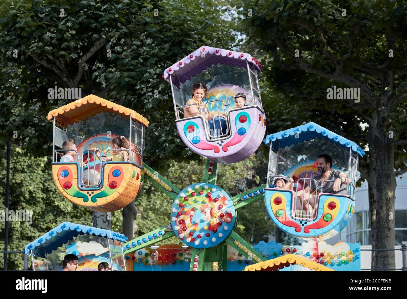 Children on a small ferris wheel in Frankfurt during the Main Games ...