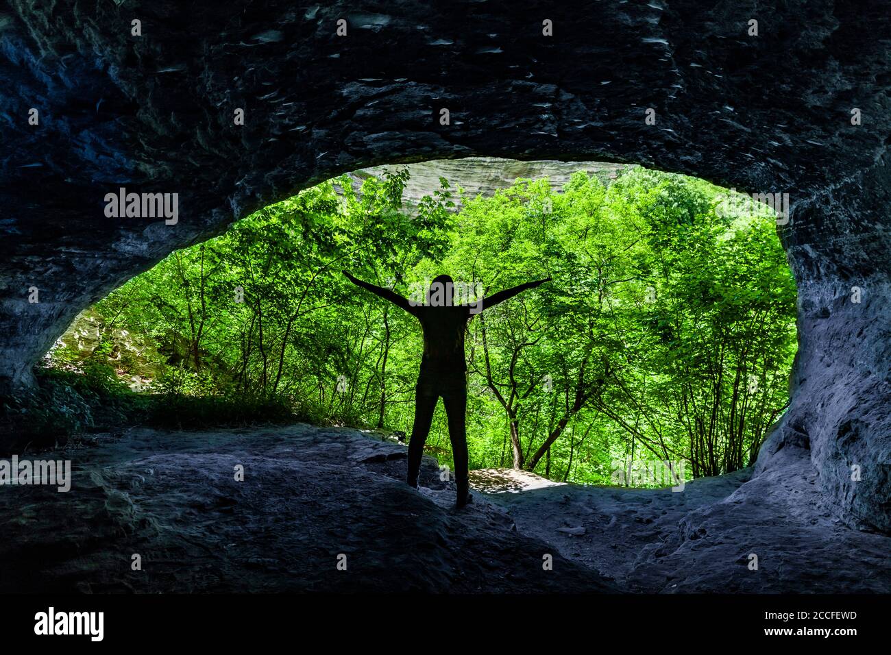 Silhouette of a woman in a cave Stock Photo - Alamy